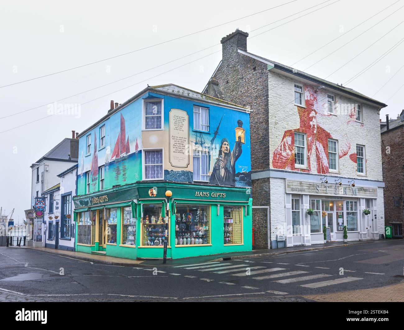 Shops by the promenade at Brixham fishing town, England Stock Photo - Alamy