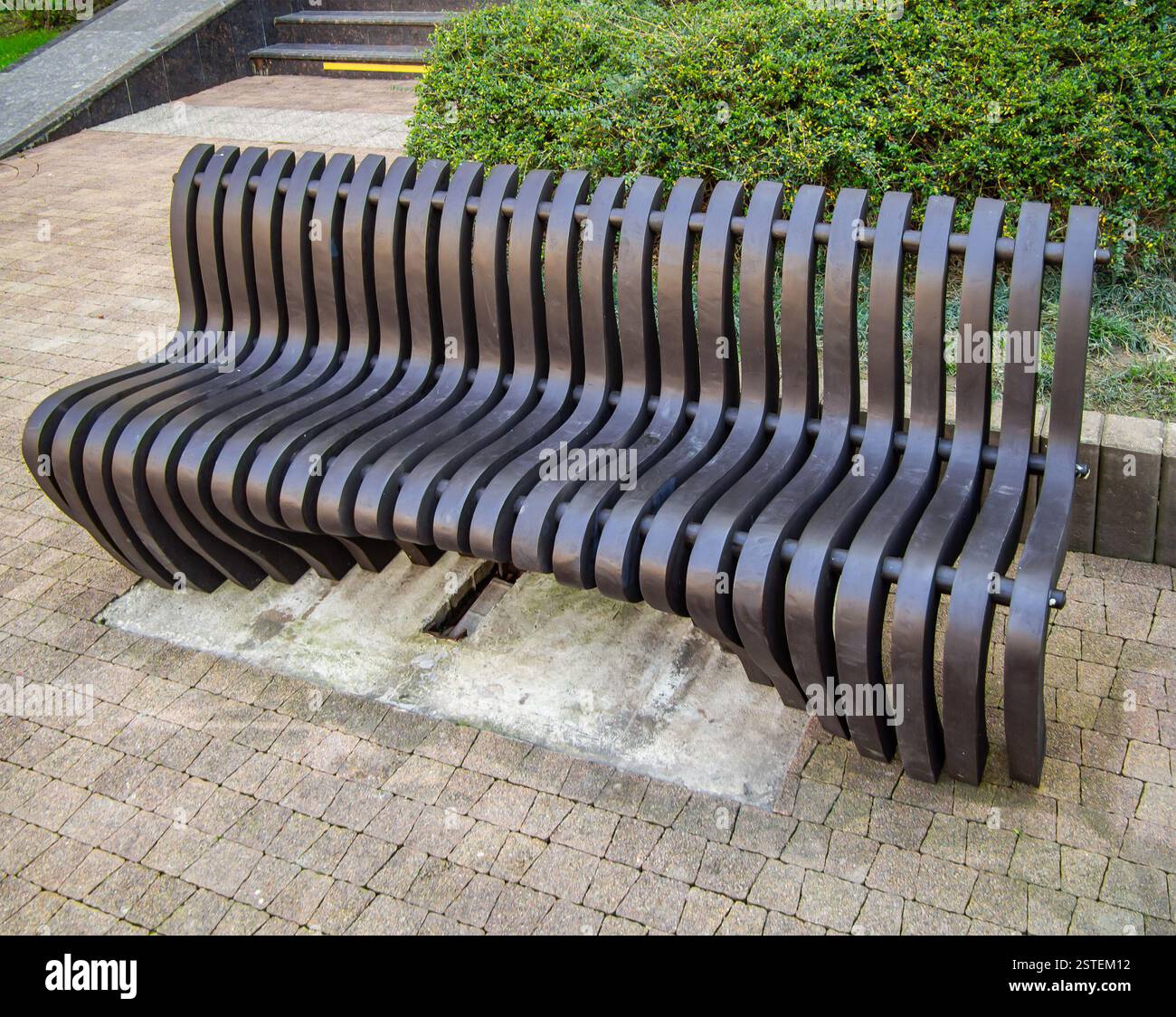 A bench made of slats made using recycled plastic Stock Photo - Alamy