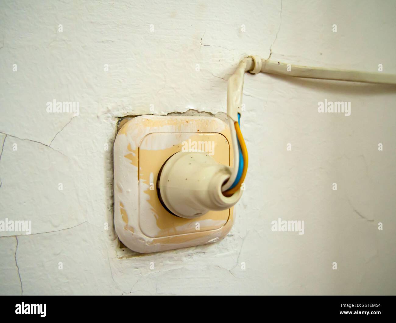 Two light switches connected to each other by a piece of wire Stock ...