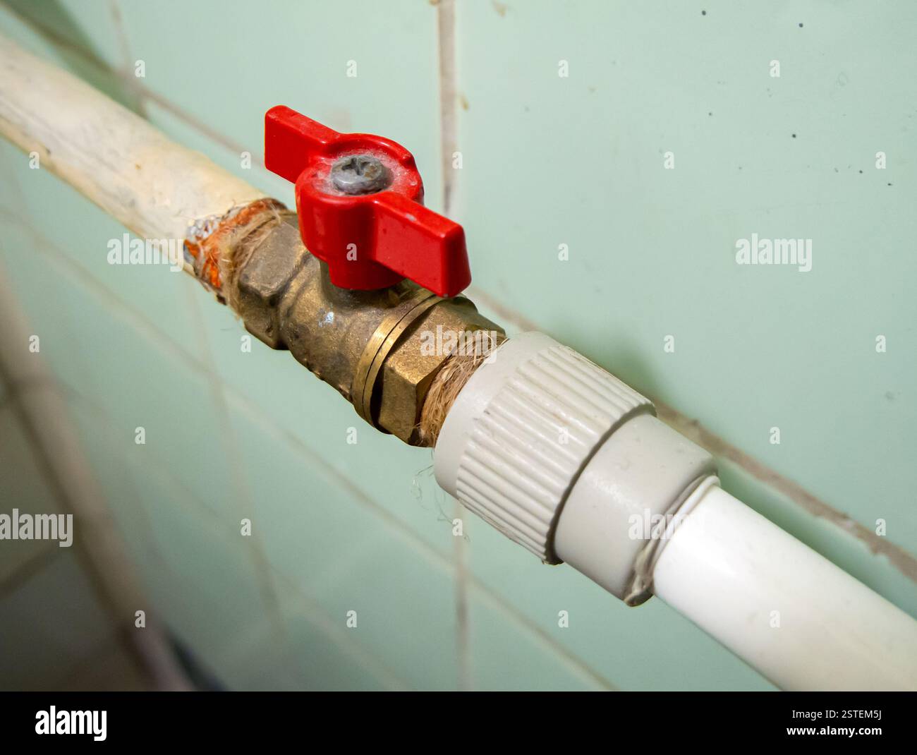 Ball valve connects metal and plastic pipes Stock Photo - Alamy