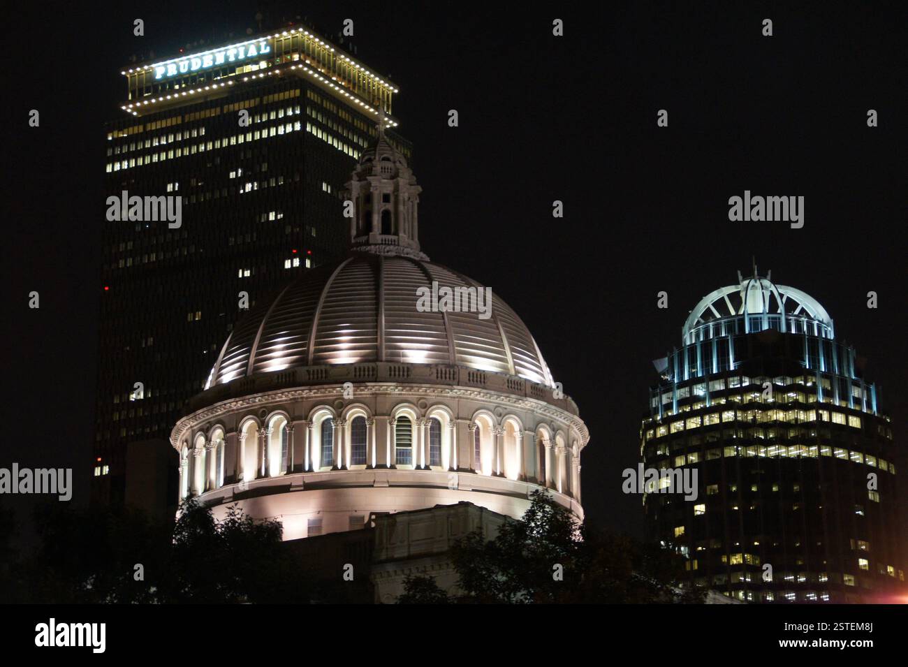 Boston skyline at night. Prudential Tower dominates with its ...