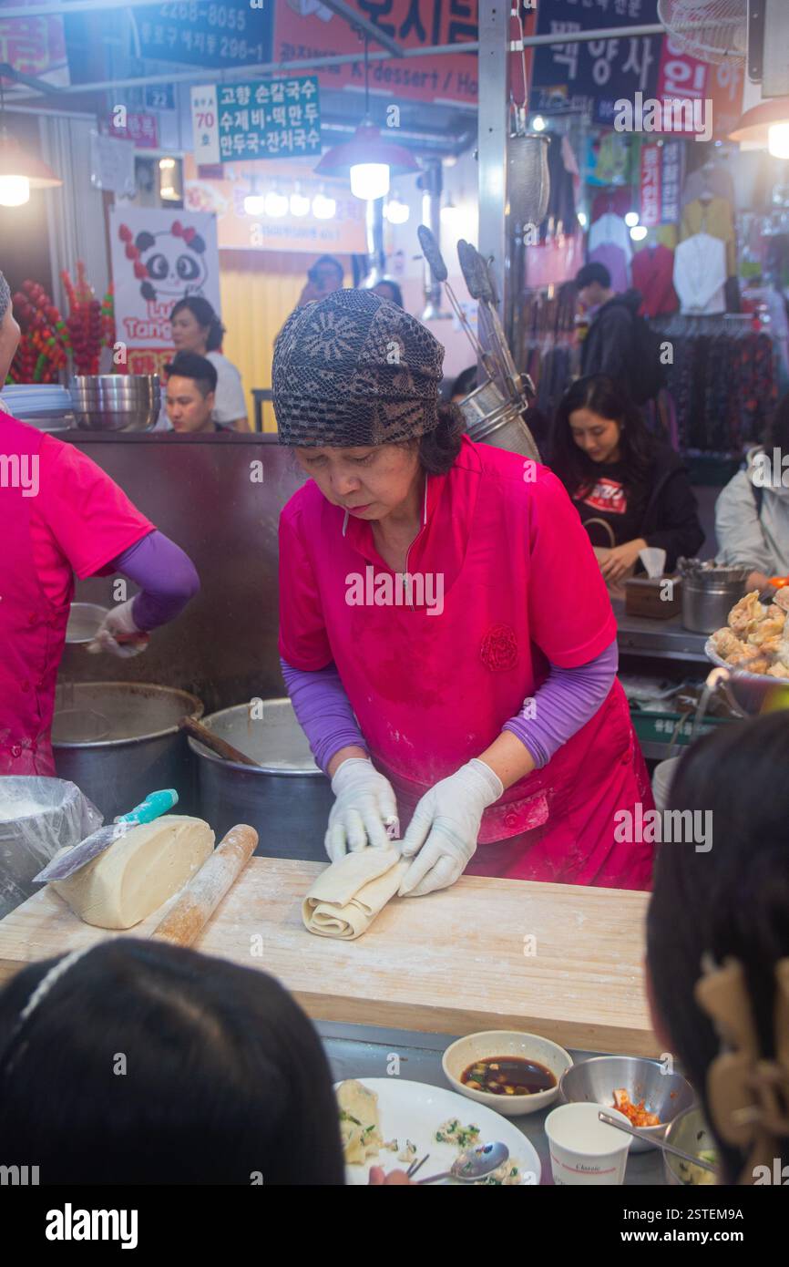 Seoul, South Korea - October 26, 2024: The woman making kalguksu, a ...