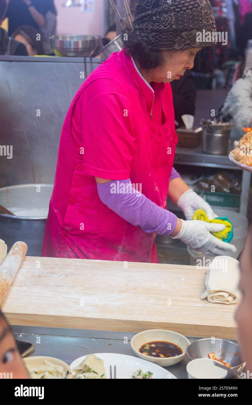 Seoul, South Korea - October 26, 2024: The woman making kalguksu, a ...