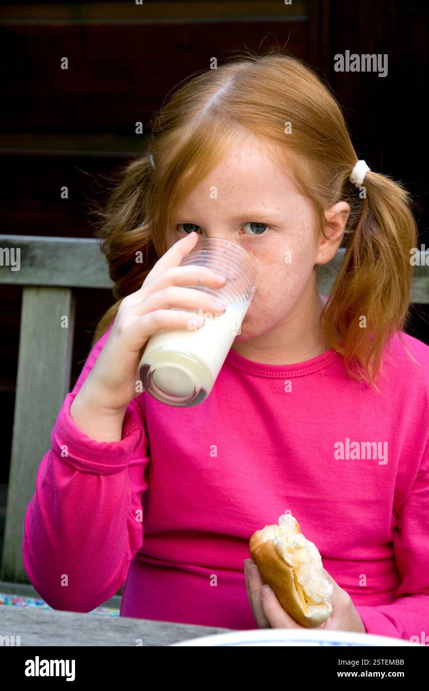 Child girl drinking milk hi-res stock photography and images - Alamy
