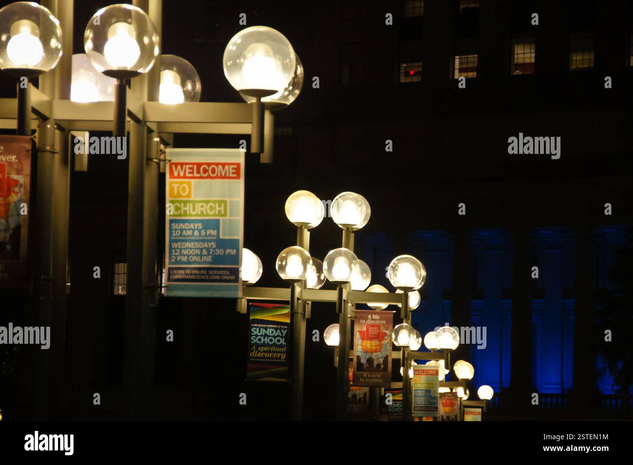 Boston street lights illuminated with banners advertising church ...
