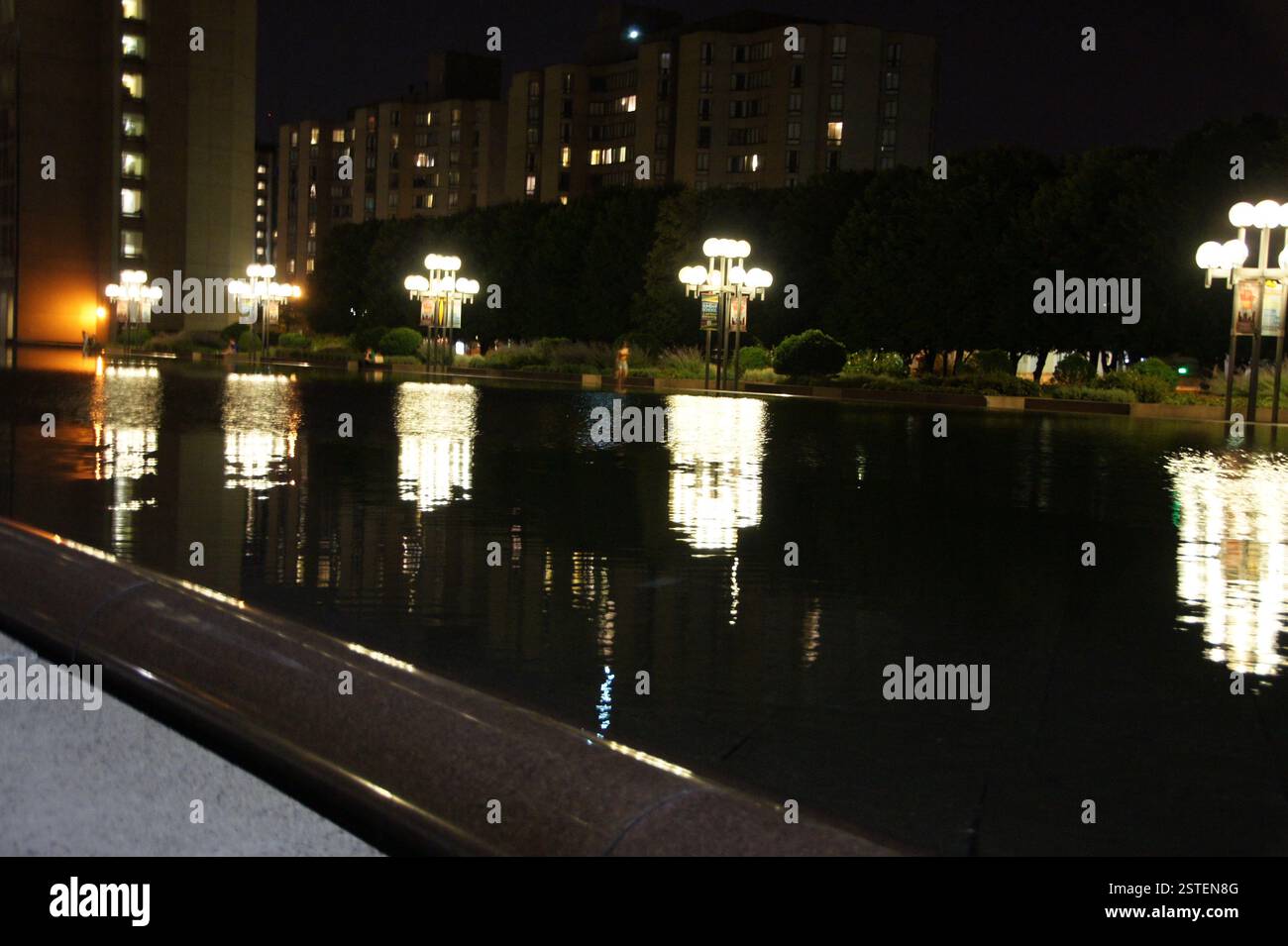 Boston Cityscape. Buildings illuminated at night reflecting in a pond ...