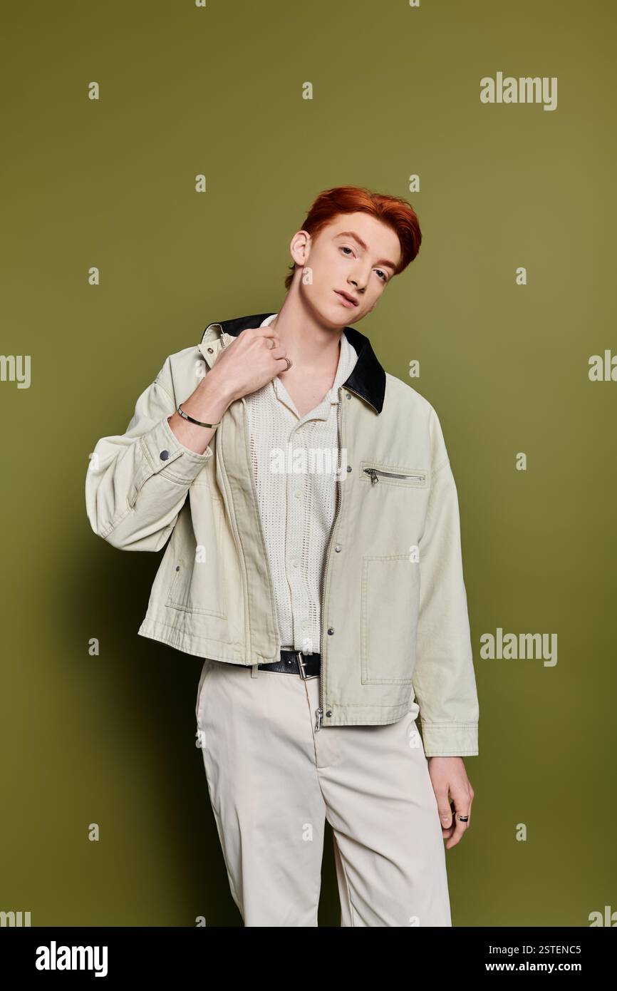 A handsome young man with striking red hair shows emotion through his ...
