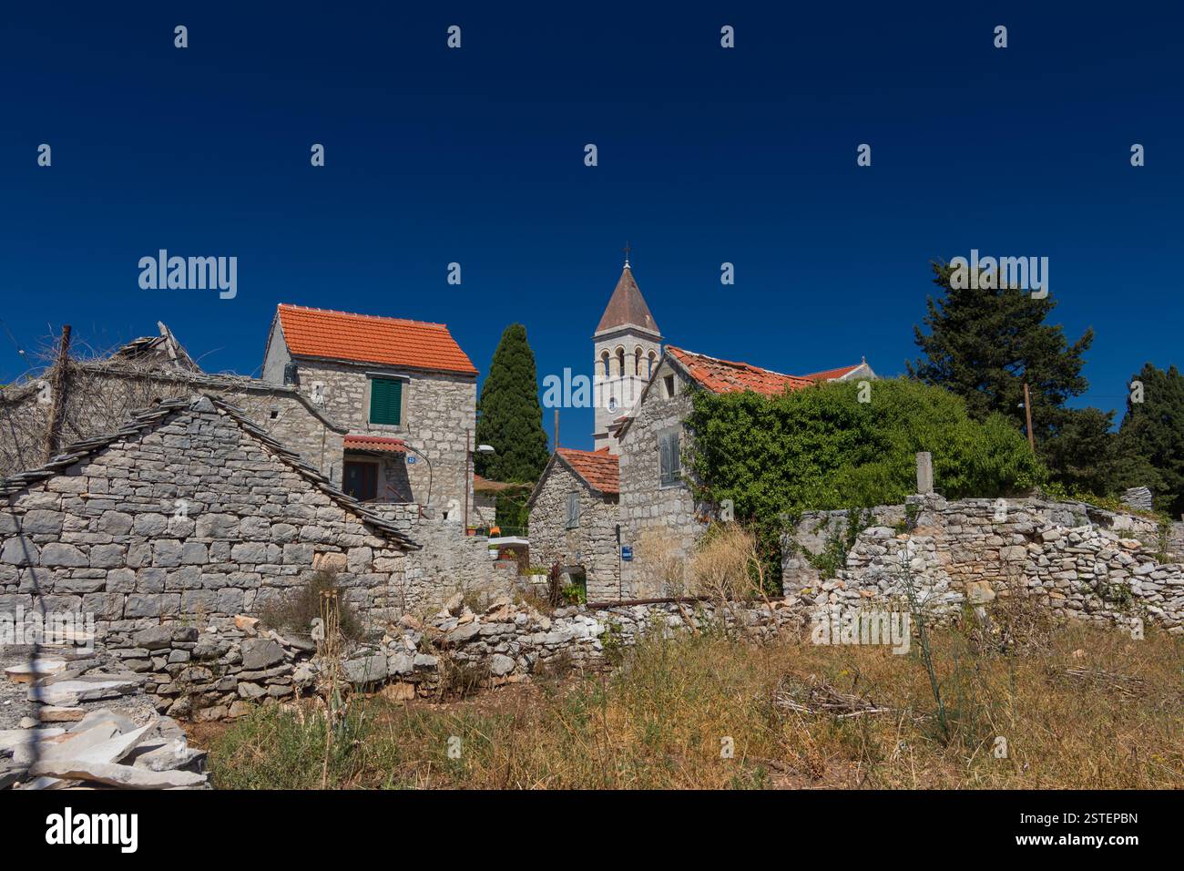 Idyllic rural scene showcasing a charming stone-built village featuring ...