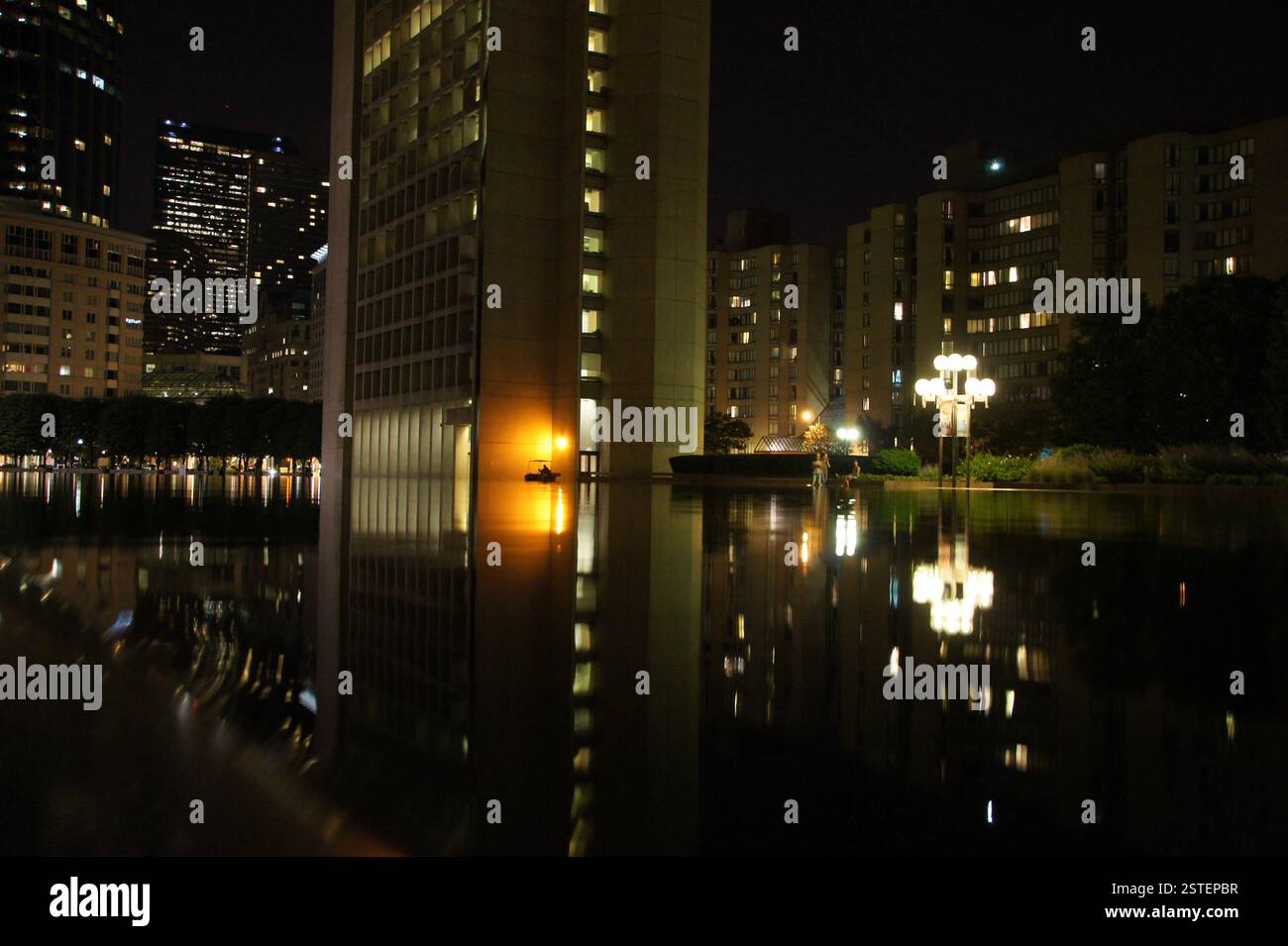 Boston City Hall Plaza at Night. Illuminated building reflected in pool ...
