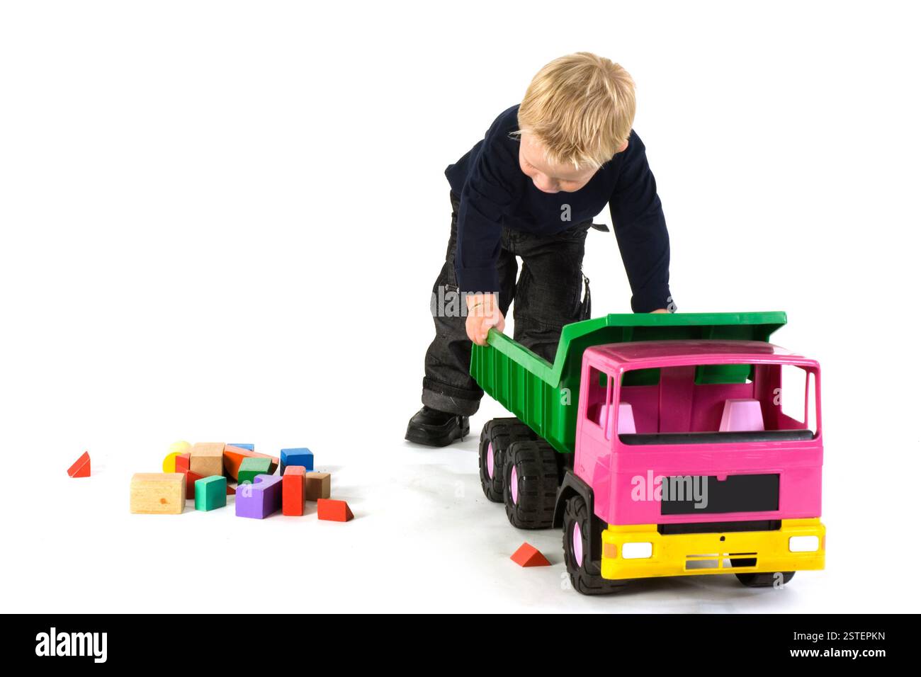 Child boy playing colored blocks Cut Out Stock Images & Pictures - Alamy