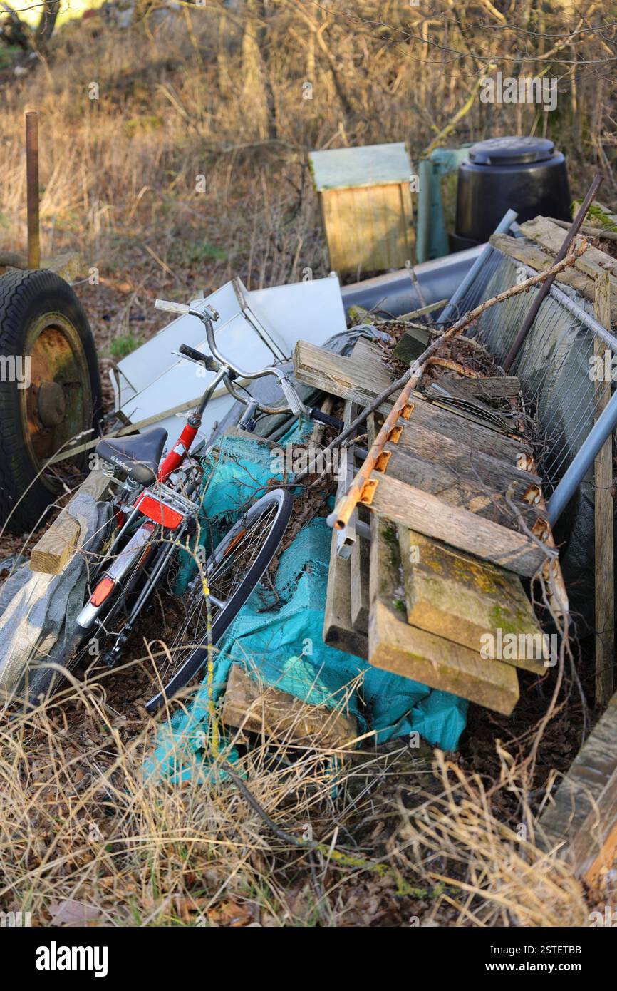Garbage and rubbish were disposed of in a hedge Stock Photo - Alamy