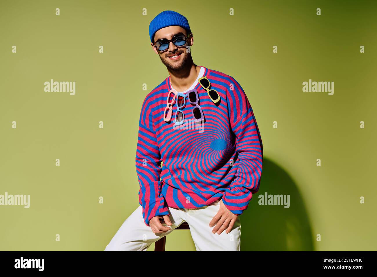 Handsome young man displays his unique fashion sense while posing in a ...