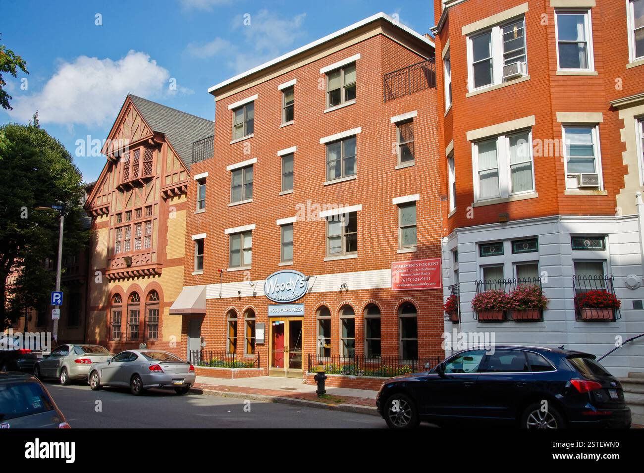 Restaurant. Red brick building with arched windows and outdoor seating ...