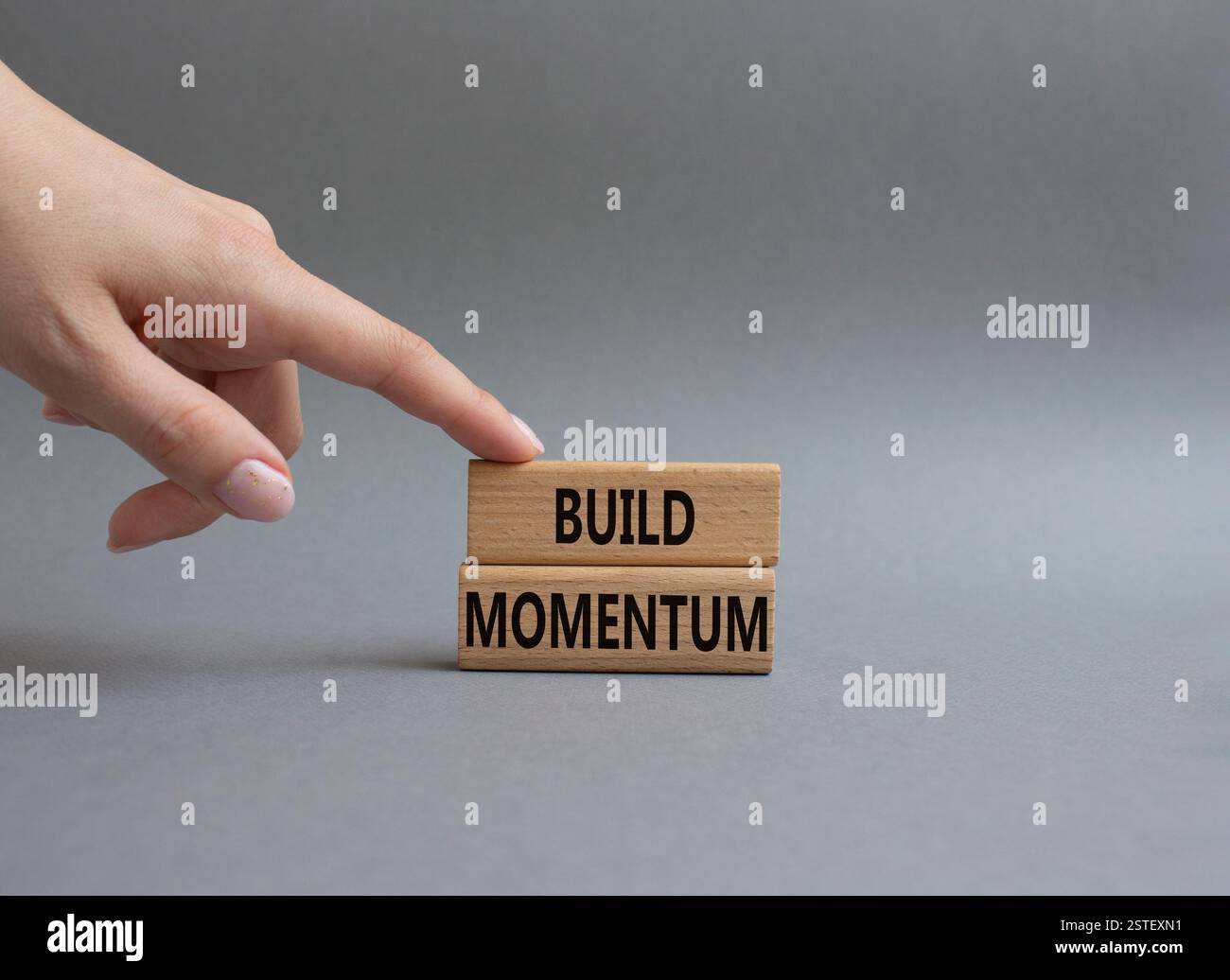 Build momentum symbol. Wooden blocks with words Build momentum ...