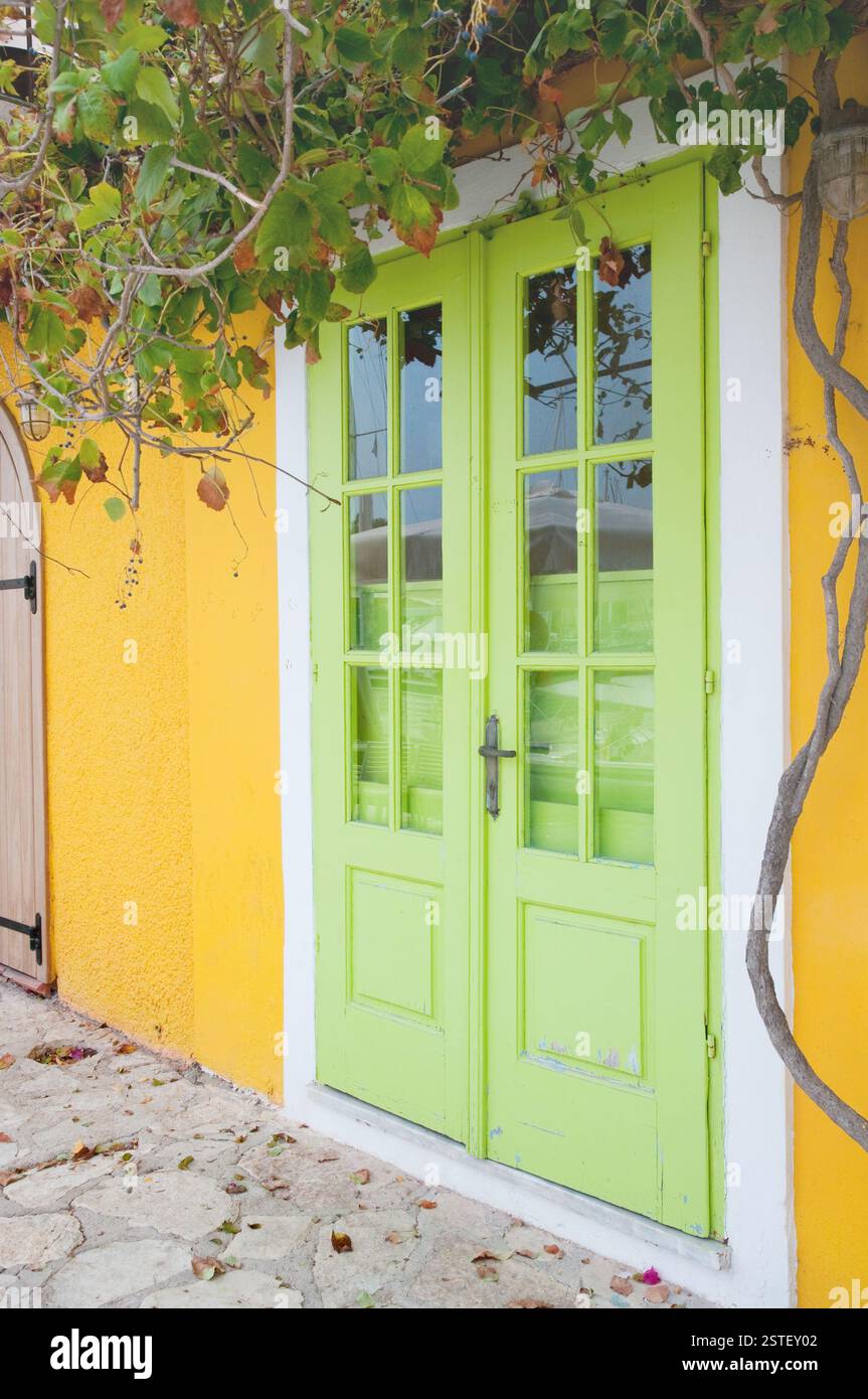 Green greek double door in yellow house hi-res stock photography and ...
