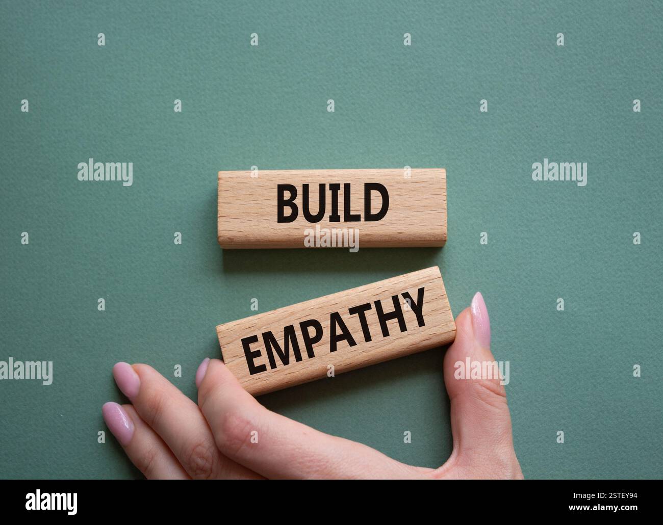 Build empathy symbol. Wooden blocks with words Build empathy ...