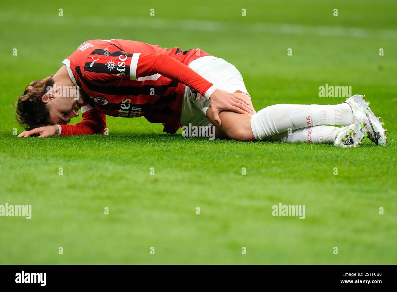 AC Milan's Joao Felix lies on the pitch after an injury during ...