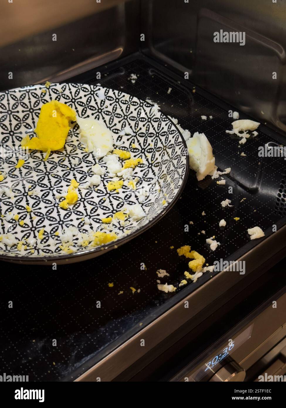 Exploded egg in microwave, cleaning concept and food safety awareness ...