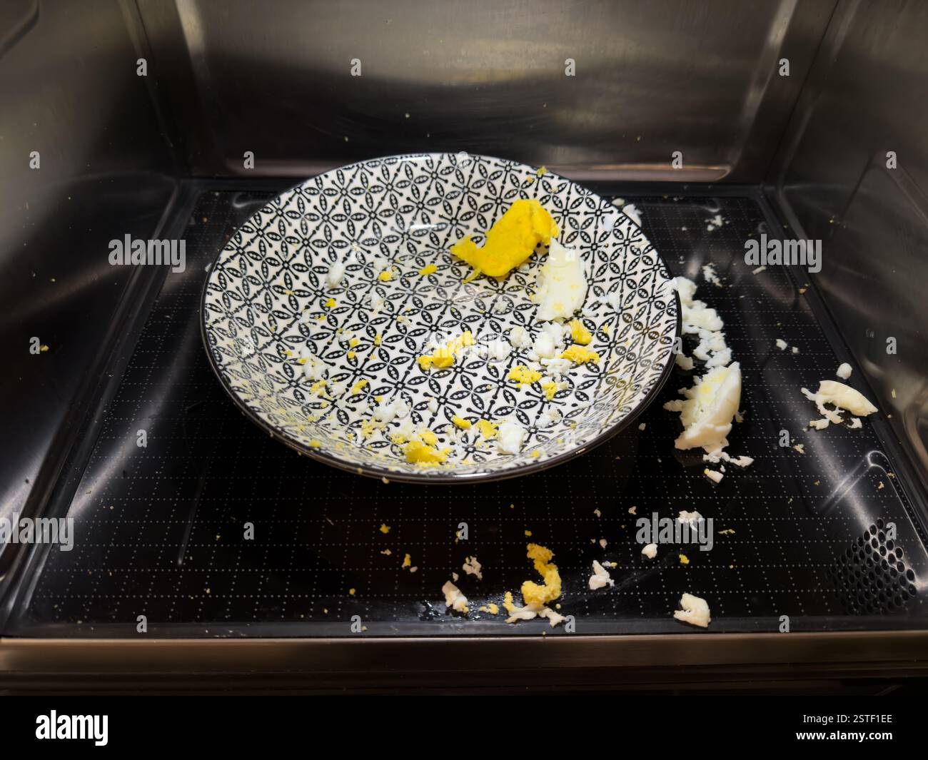 Exploded egg in microwave, cleaning concept and food safety awareness ...