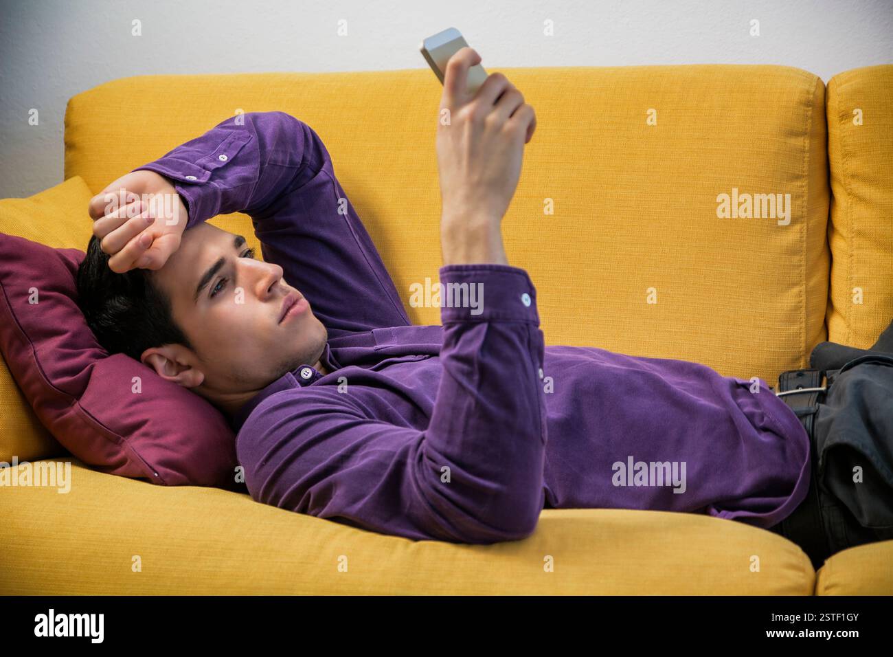 Man laying couch hi-res stock photography and images - Alamy