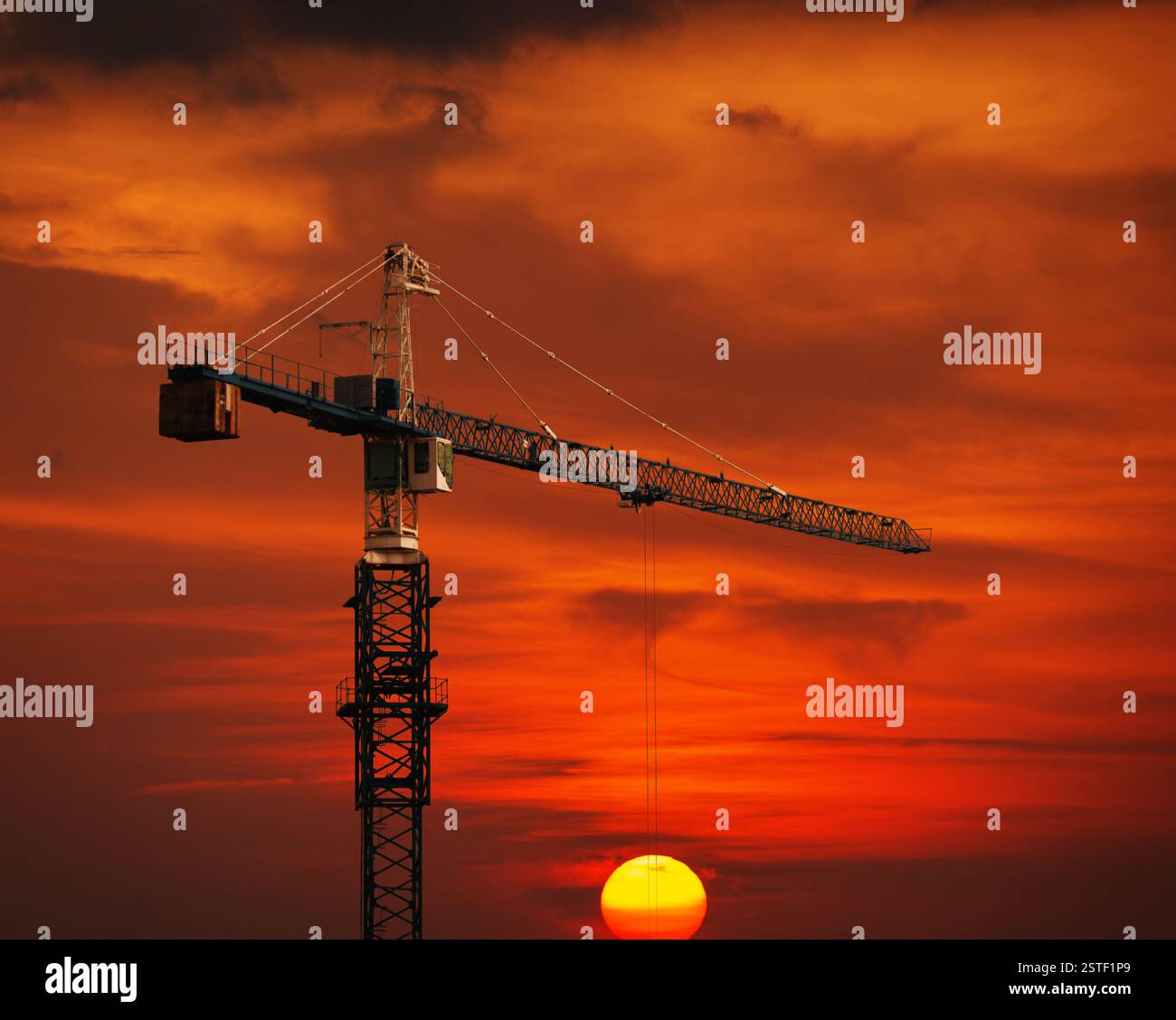 Construction Crane Hoisting the Sun Stock Photo - Alamy