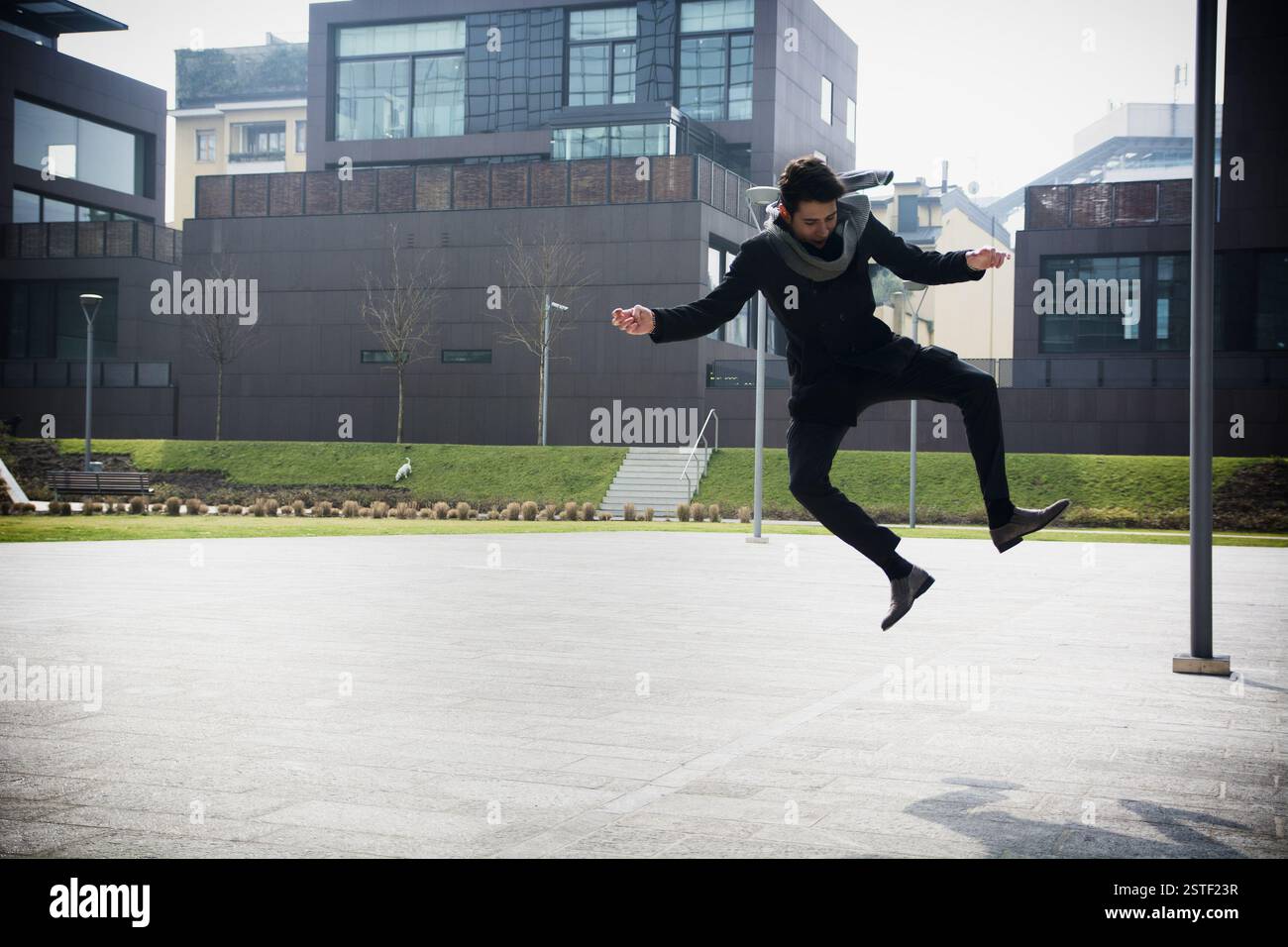Handsome young man jumping for joy Stock Photo - Alamy