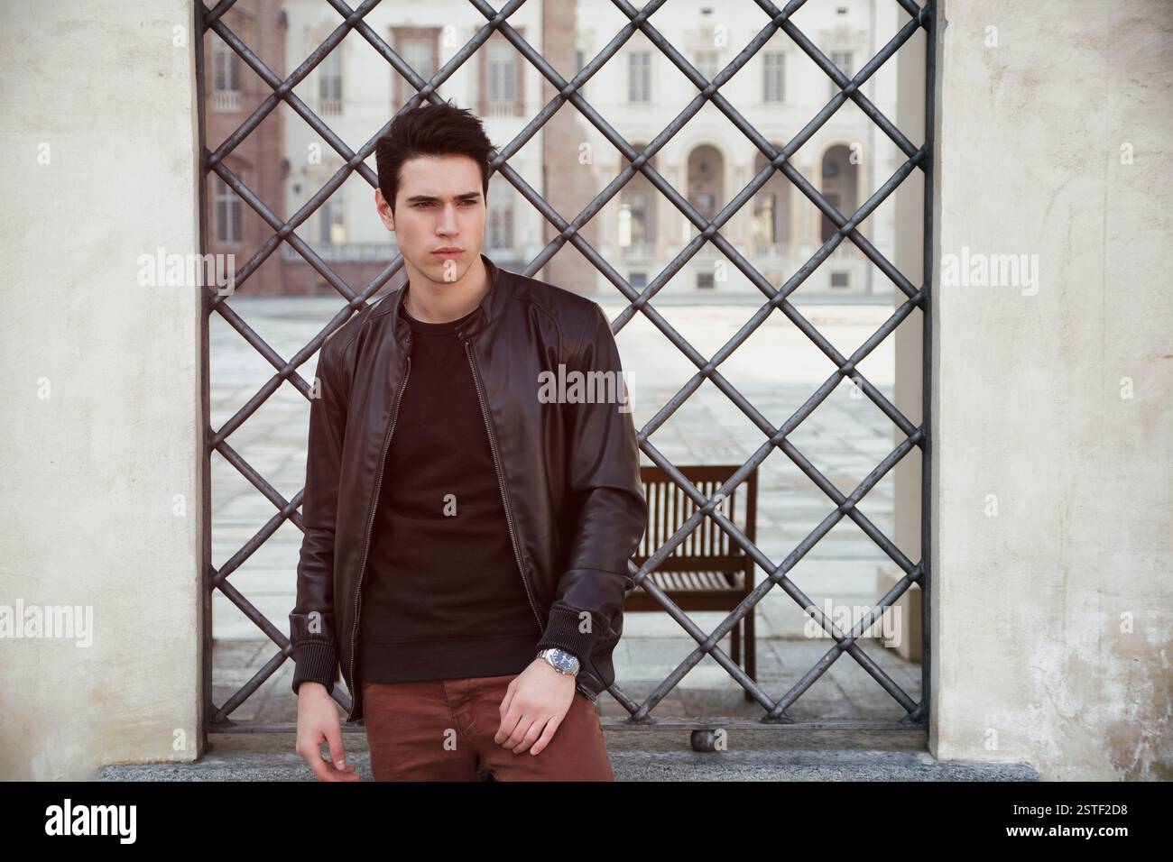 Handsome young man outside historical building in European city Stock ...