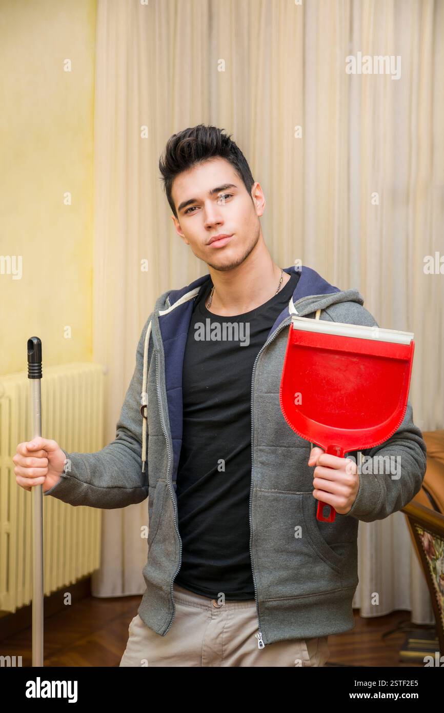 Man cleaning home broom hi-res stock photography and images - Alamy