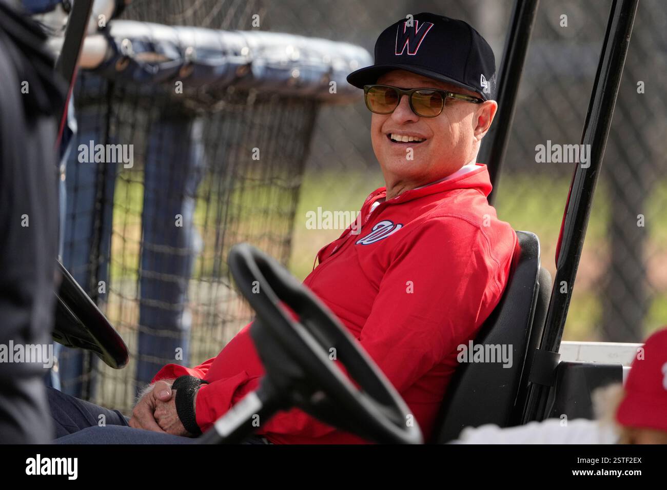 Washington Nationals owner Mark Lerner watches from a golf cart during ...