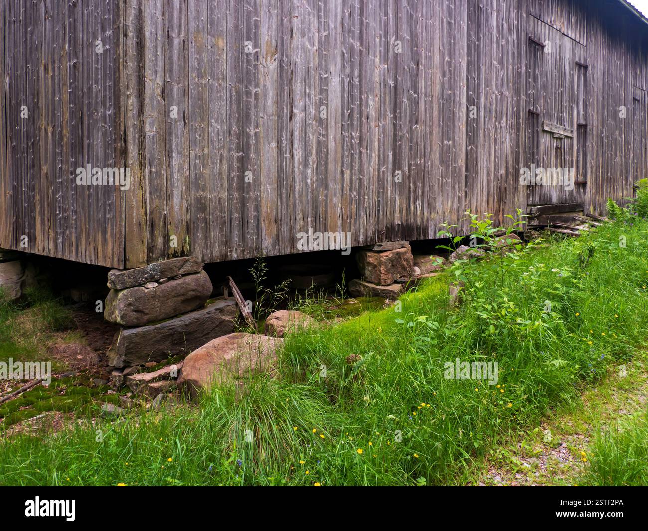 The leg of an old wooden warehouse building from northern Sweden. The ...