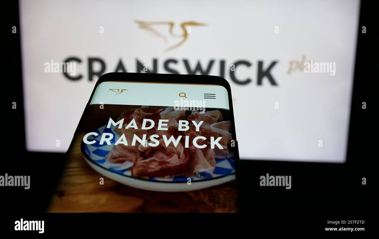 In this photo illustration, a mobile phone with the website of British ...