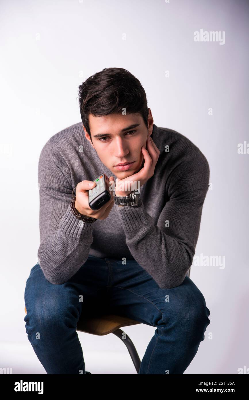 Man with remote control hi-res stock photography and images - Alamy