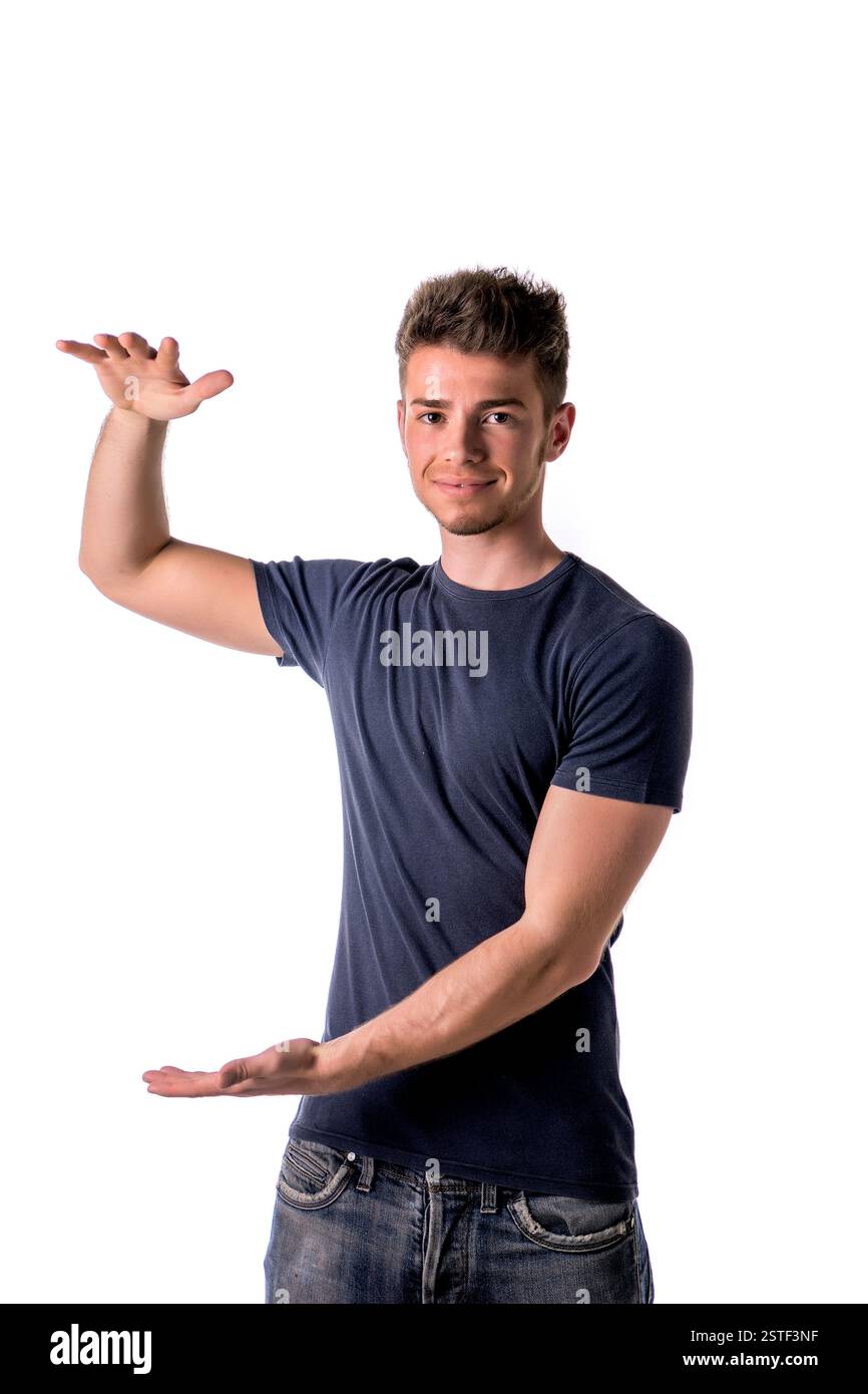 Young man holding empty vertical space between hands Stock Photo - Alamy Young man holding empty vertical space between hands Stock Photo - Alamy