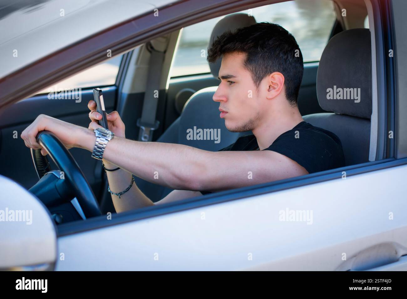 Attractive young man sending cell hi-res stock photography and images ...