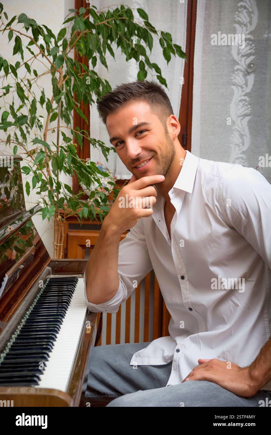 Young happy male composer hi-res stock photography and images - Alamy