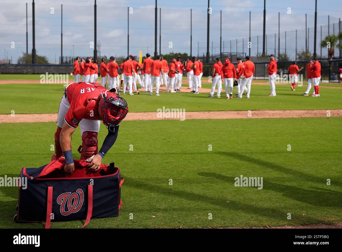 Washington Nationals catcher Andrew Knizner looks through his bag as ...