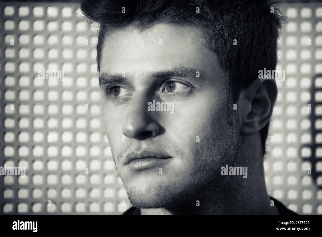 Headshot of attractive young man looking to a side Stock Photo - Alamy
