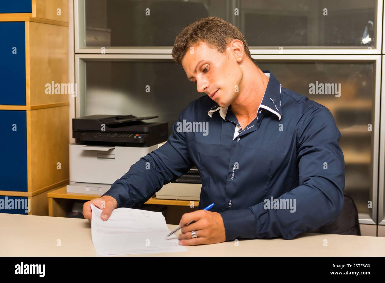 Business man showing document hi-res stock photography and images - Alamy