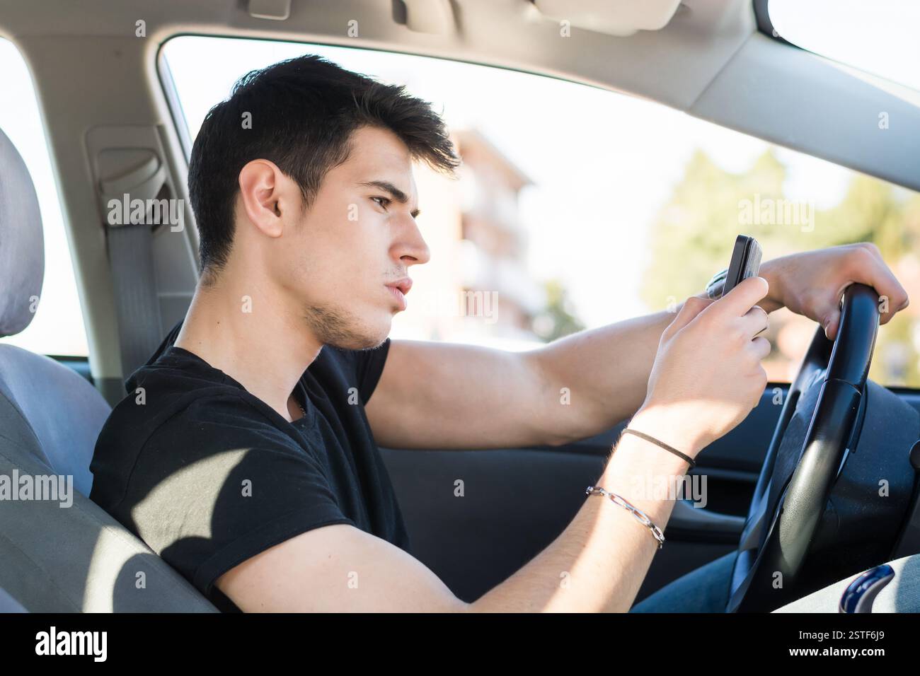 Using mobile when driving hi-res stock photography and images - Alamy