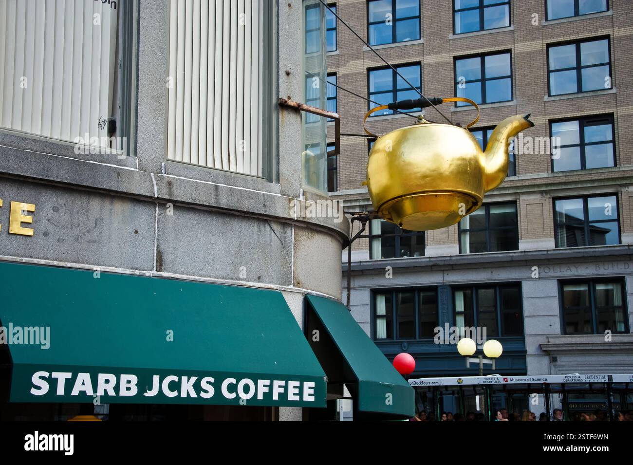 Giant golden kettle hangs above Starbucks. Quirky Boston landmark ...