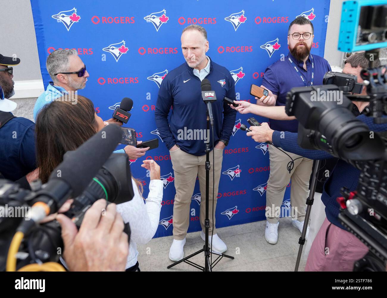 Mark Shapiro, center, president and CEO of the Toronto Blue Jays ...