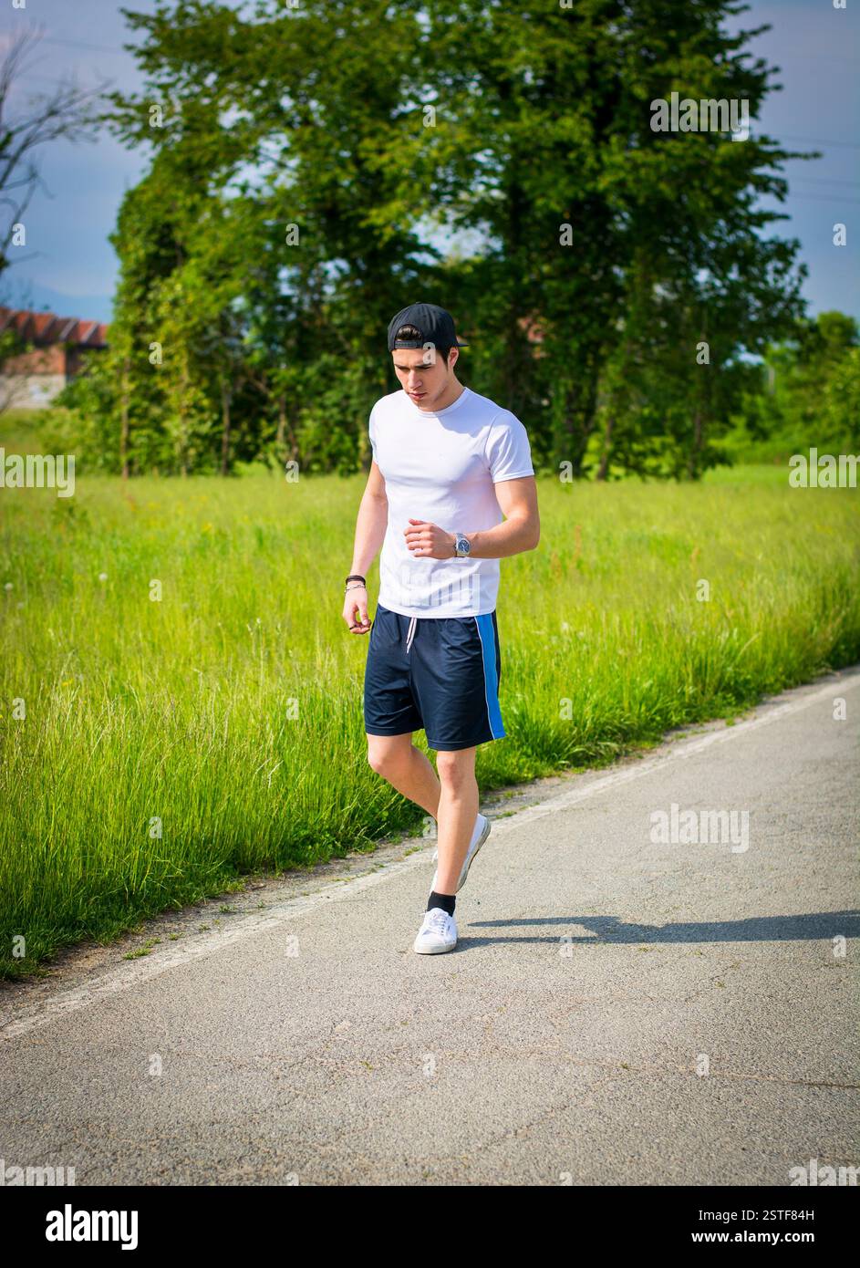 Person running in road hi-res stock photography and images - Alamy