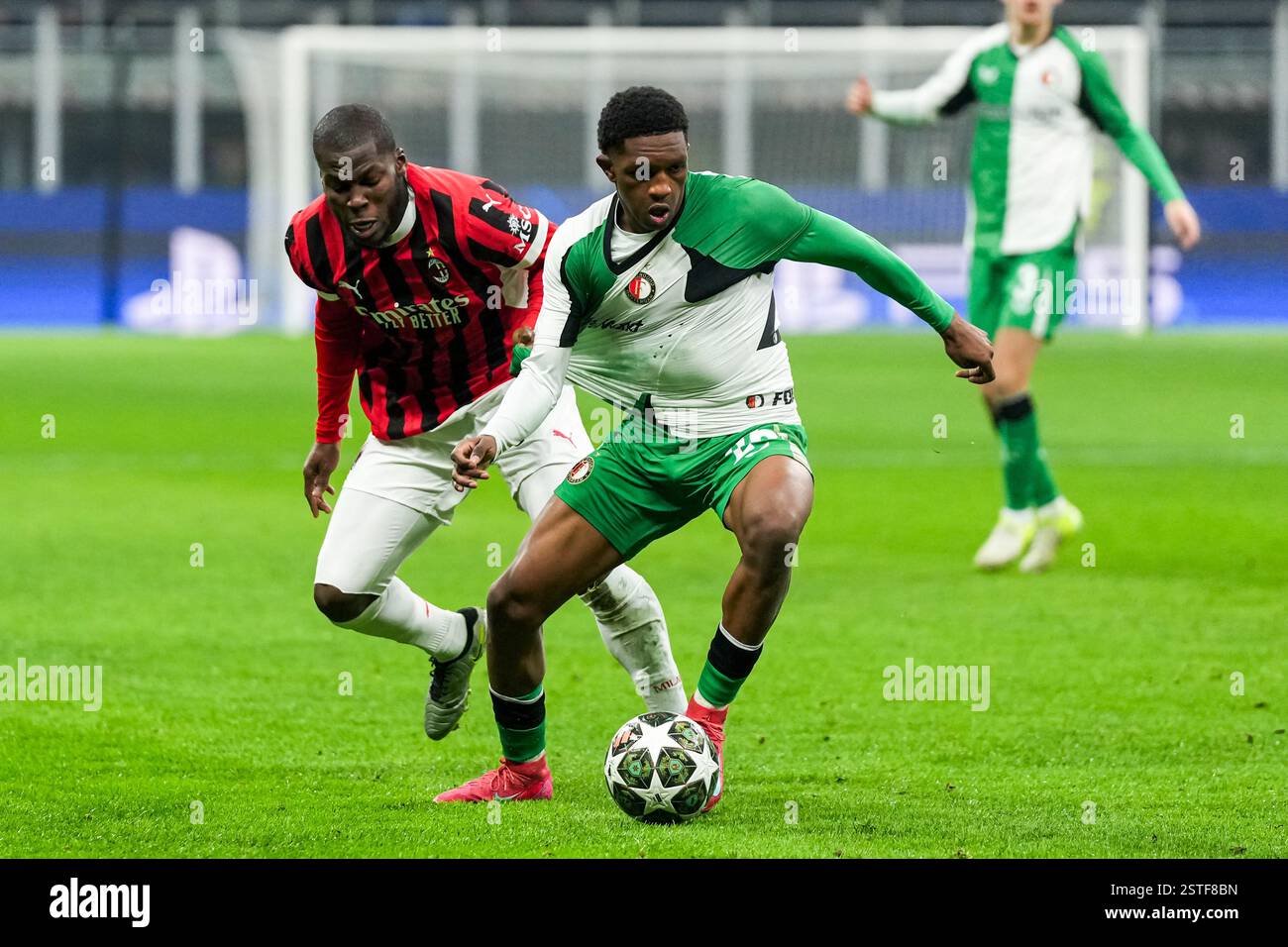 Milan, Italy. 18th Feb, 2025. Milan - Yunus Musah of AC Milan, Givairo Read of Feyenoord during ...