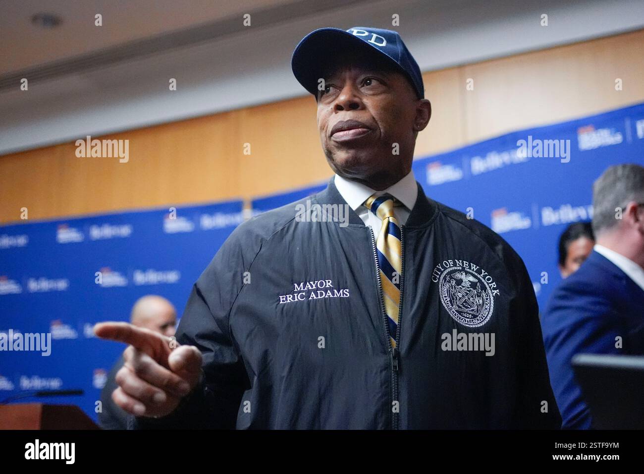 New York City mayor Eric Adams speaks to reporters as he leaves a news ...