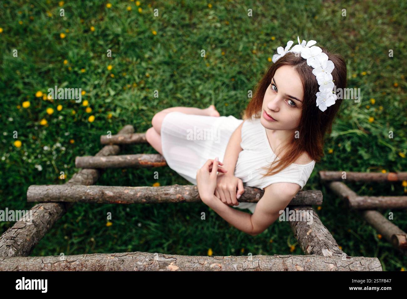 Girl up ladder tree hi-res stock photography and images - Alamy