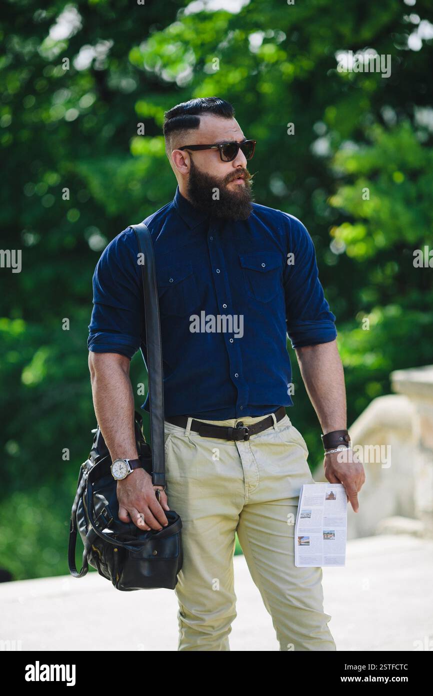 Bearded man in sunglasses walks hi-res stock photography and images - Alamy