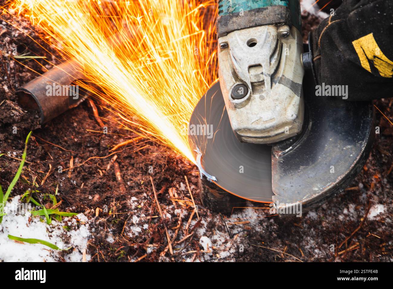 Worker uses angle grinder in hi-res stock photography and images - Alamy