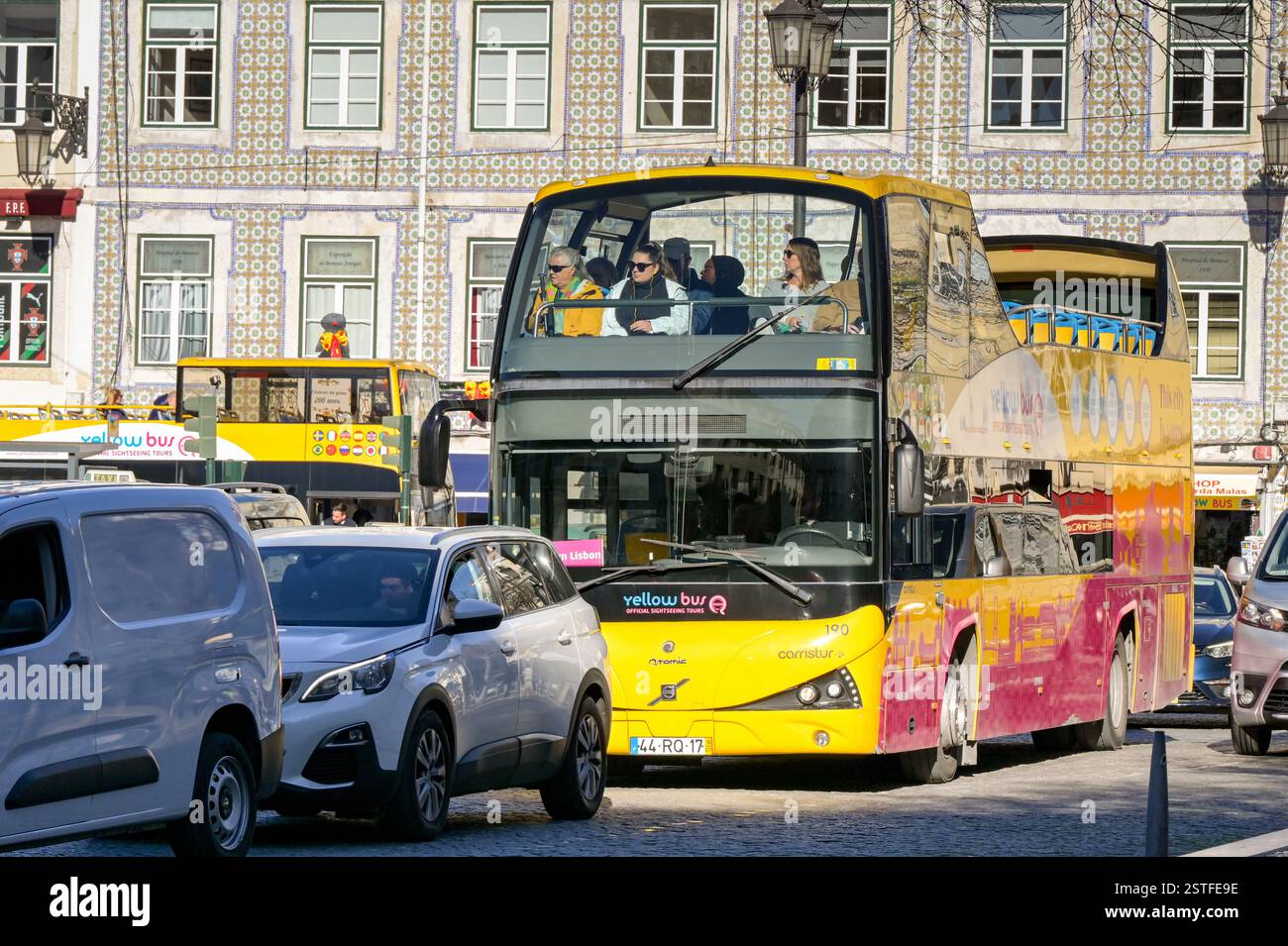 Lisbon, Portugal - 13 January 2025: People on a hop on hop off tourist ...