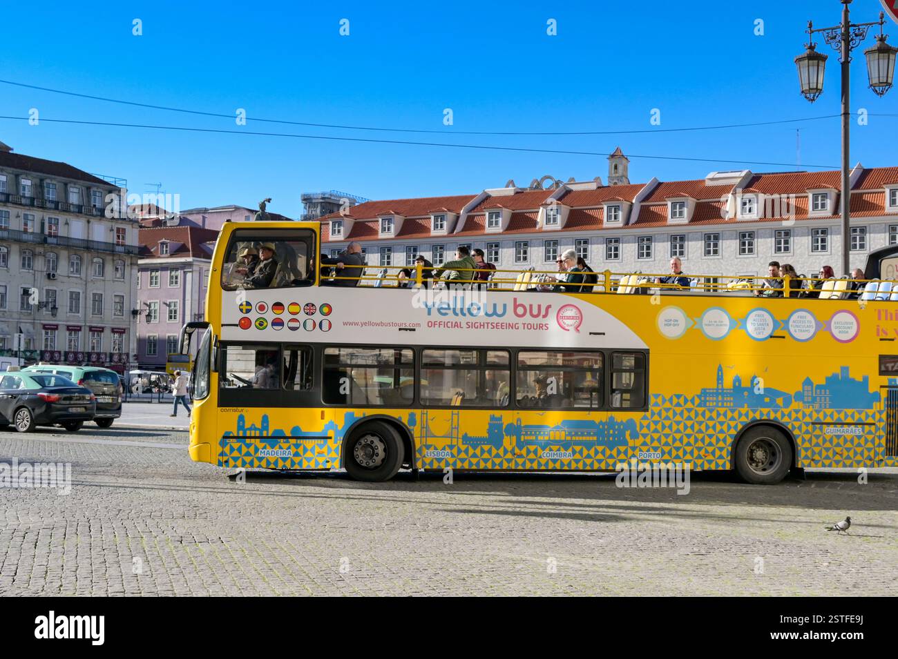 Lisbon, Portugal - 13 January 2025: People on a hop on hop off tourist ...