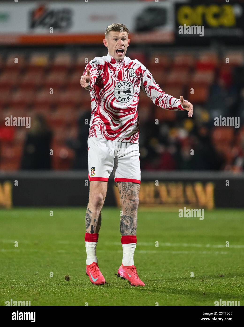 James McClean of Wrexham gives his team instructions during the pre ...